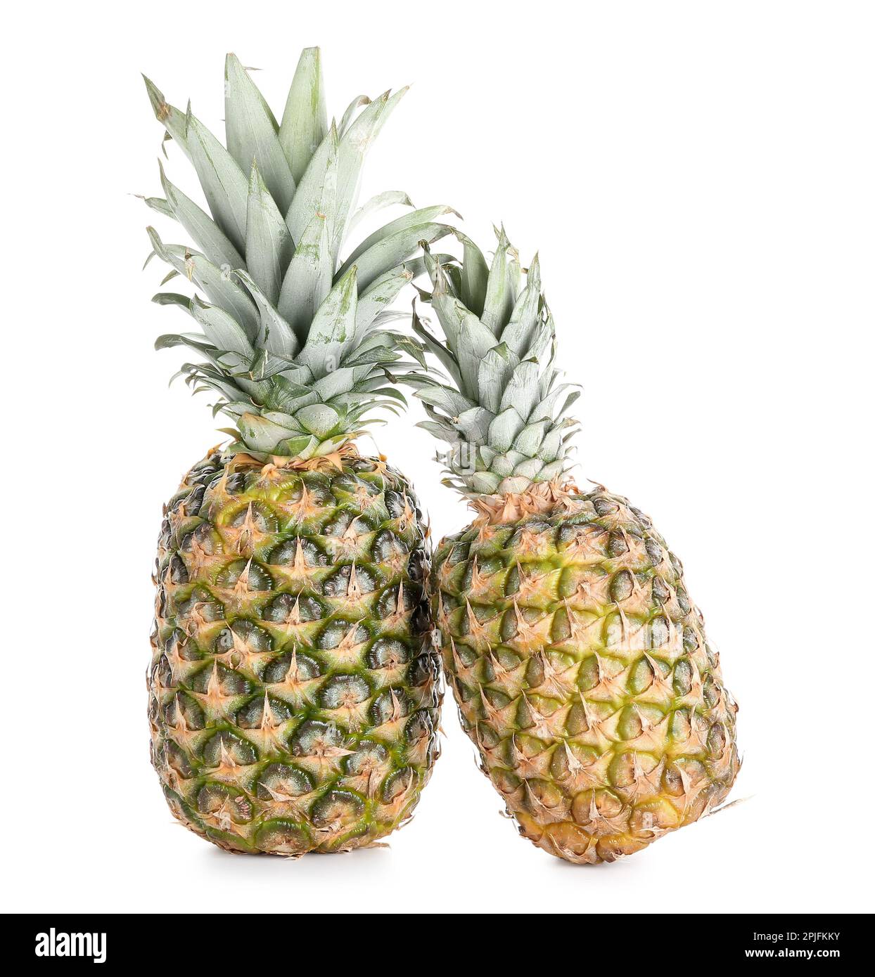Fresh ripe pineapples on white background Stock Photo - Alamy