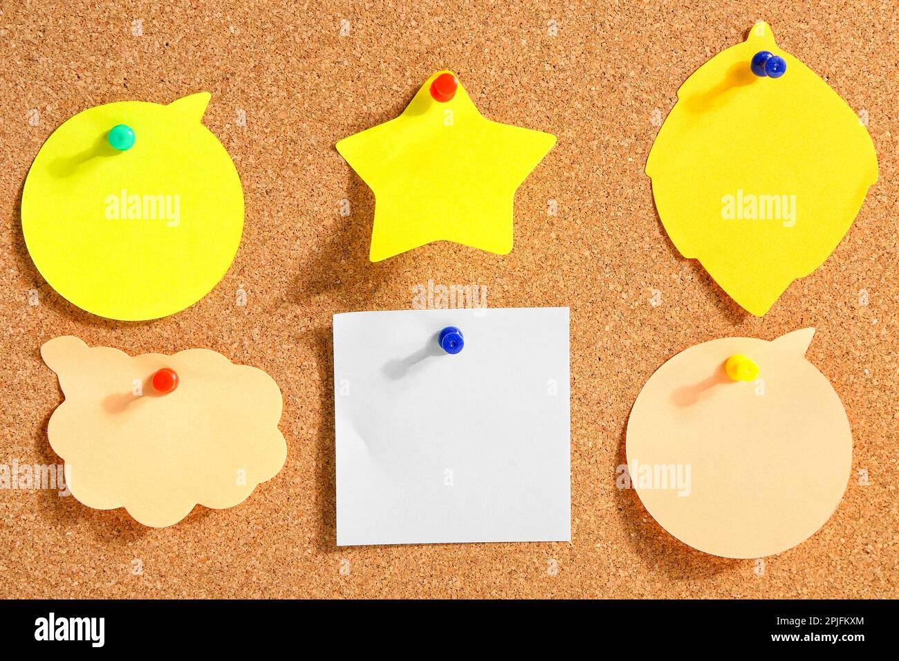 Pinned sticky notes on board Stock Photo - Alamy