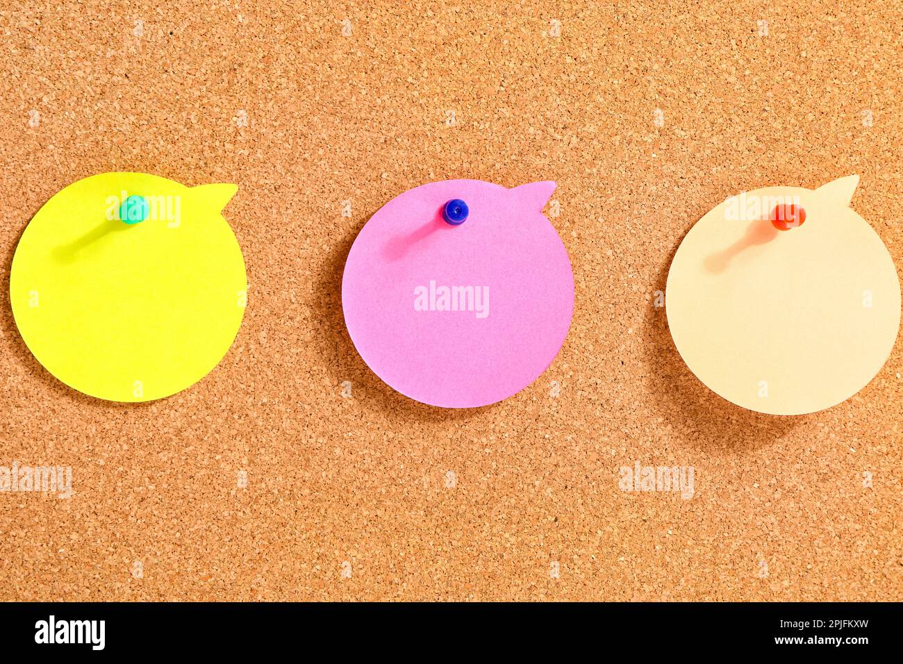 Pinned sticky notes on board Stock Photo - Alamy