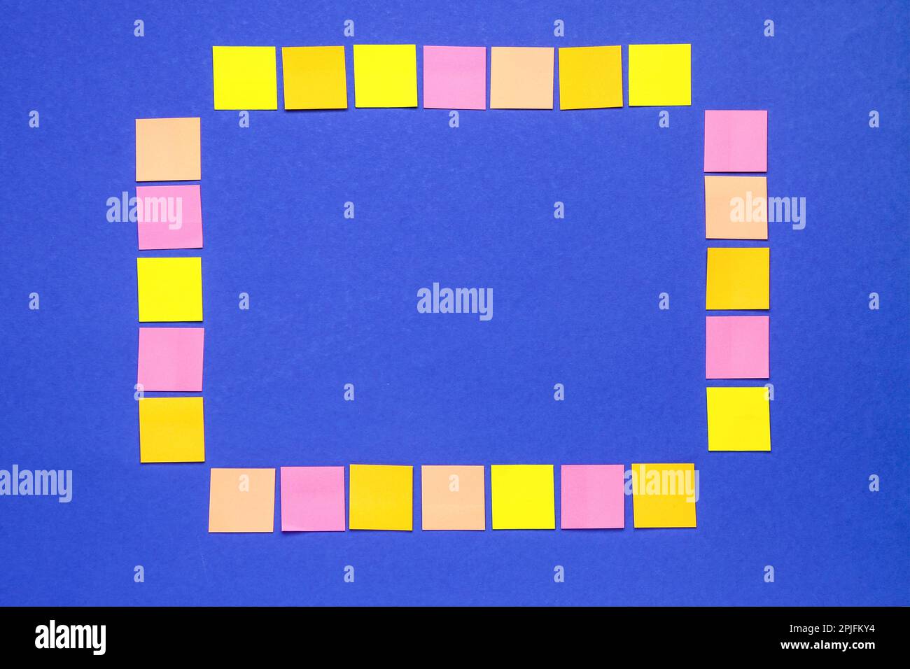 Frame made of colorful sticky notes on blue background Stock Photo - Alamy