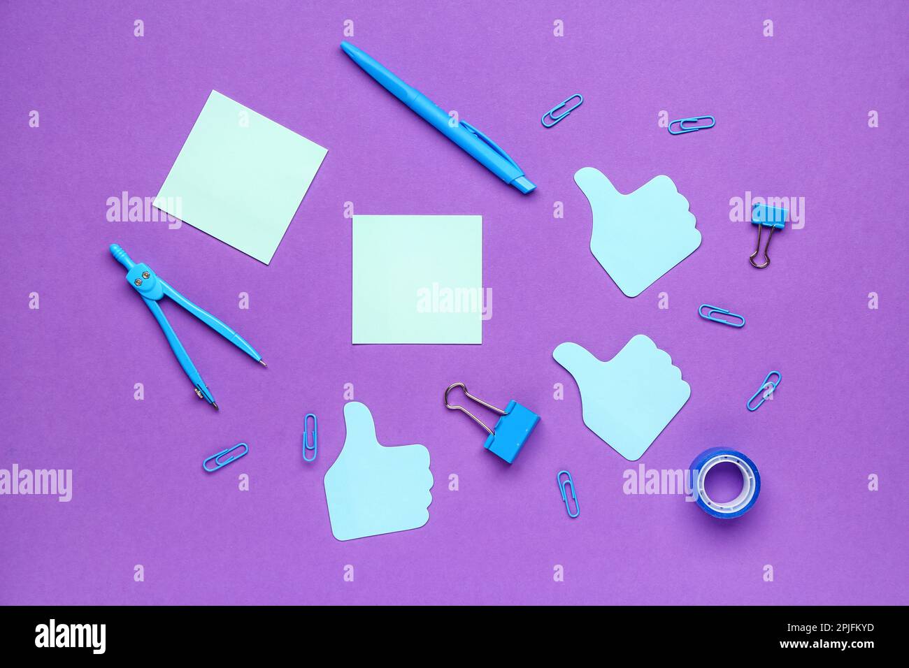 Sticky notes and stationery on purple background Stock Photo - Alamy
