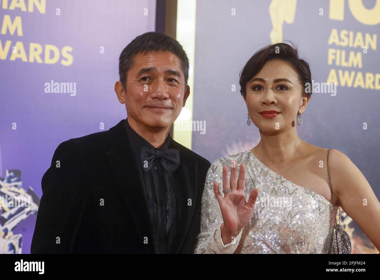 Actor Tony Leung Chin-wai (left) and his wife Carina Lau Ka-ling (right ...
