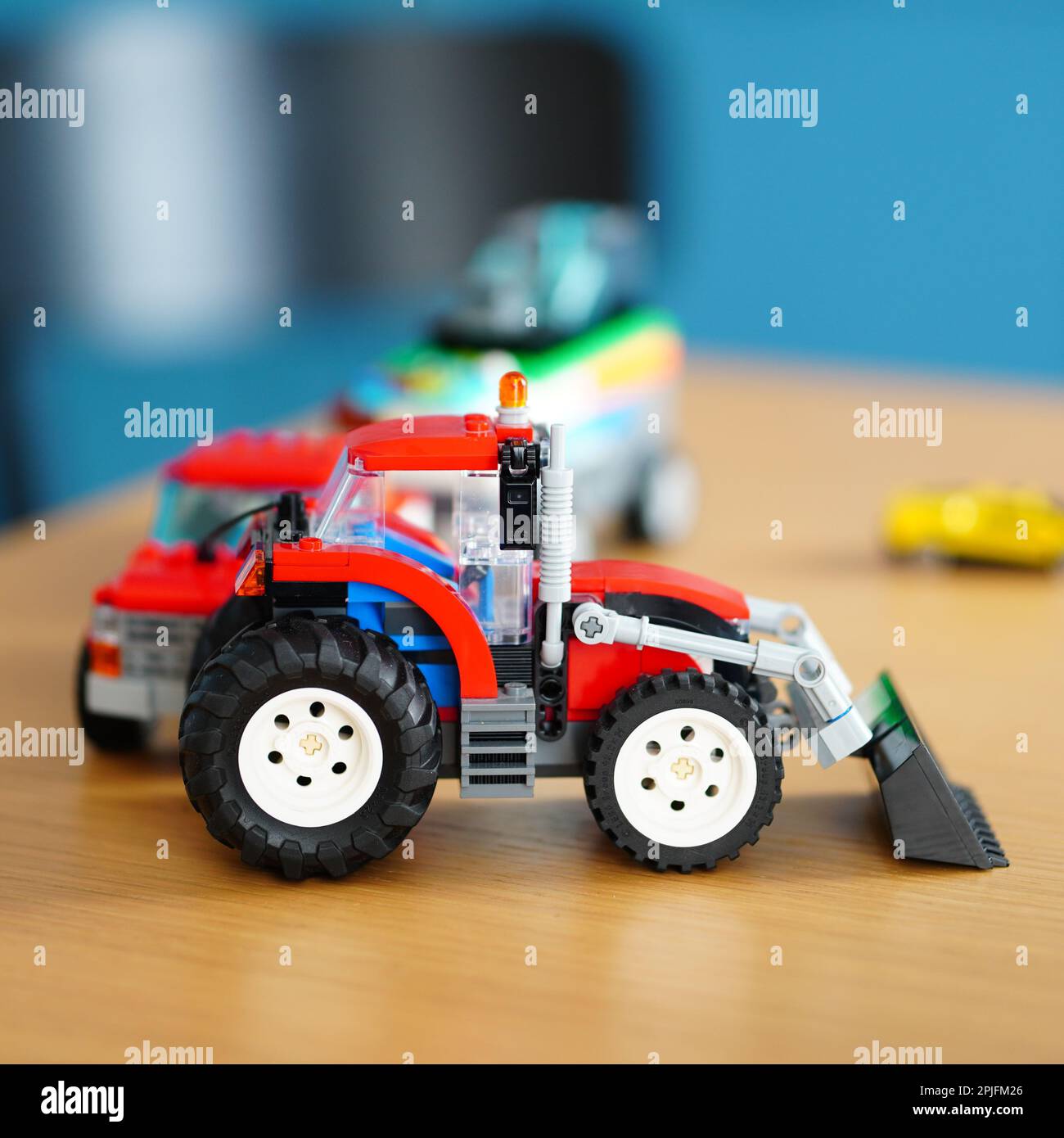 A high-resolution, closeup image of a colorful Lego toy truck, viewed ...