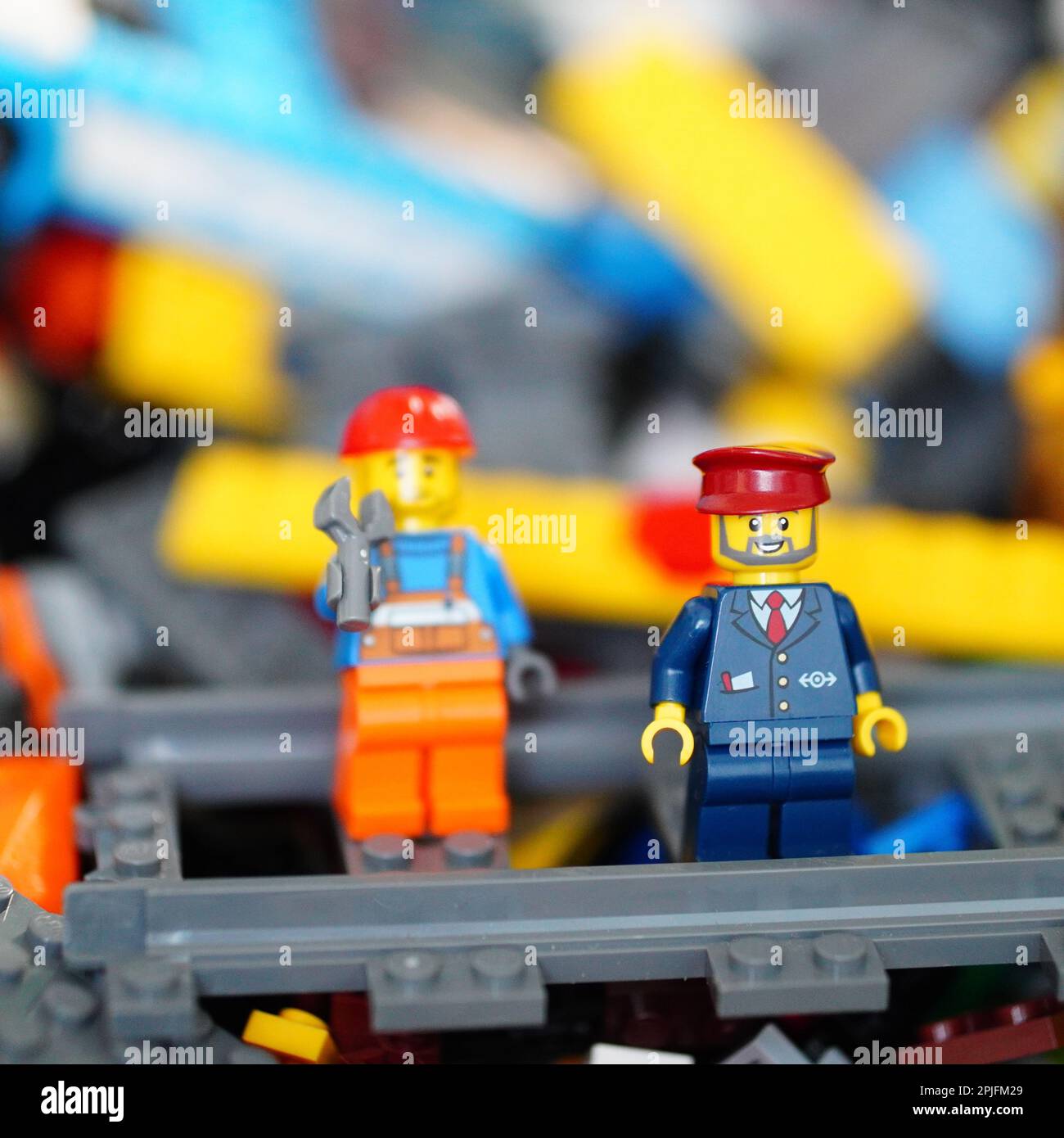 A closeup of two Lego figurines, each with unique facial expressions ...