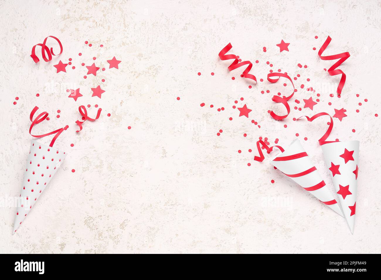 Frame made of party cones with serpentine and confetti on grunge ...