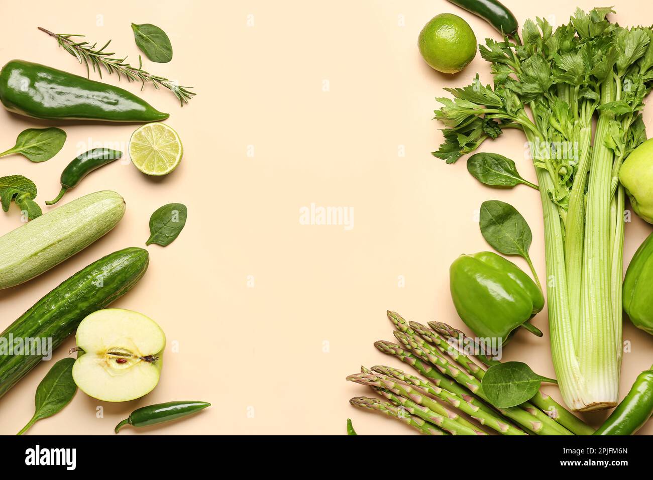 Frame made of different fresh vegetables and fruits on beige background ...