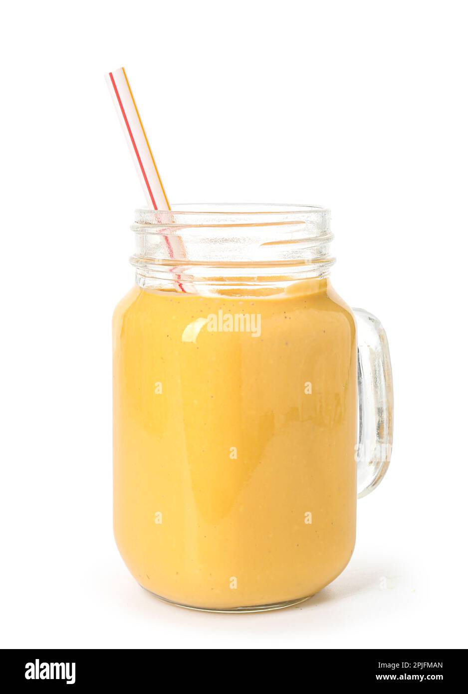 Mason jar of tasty yellow smoothie with straw on white background Stock ...