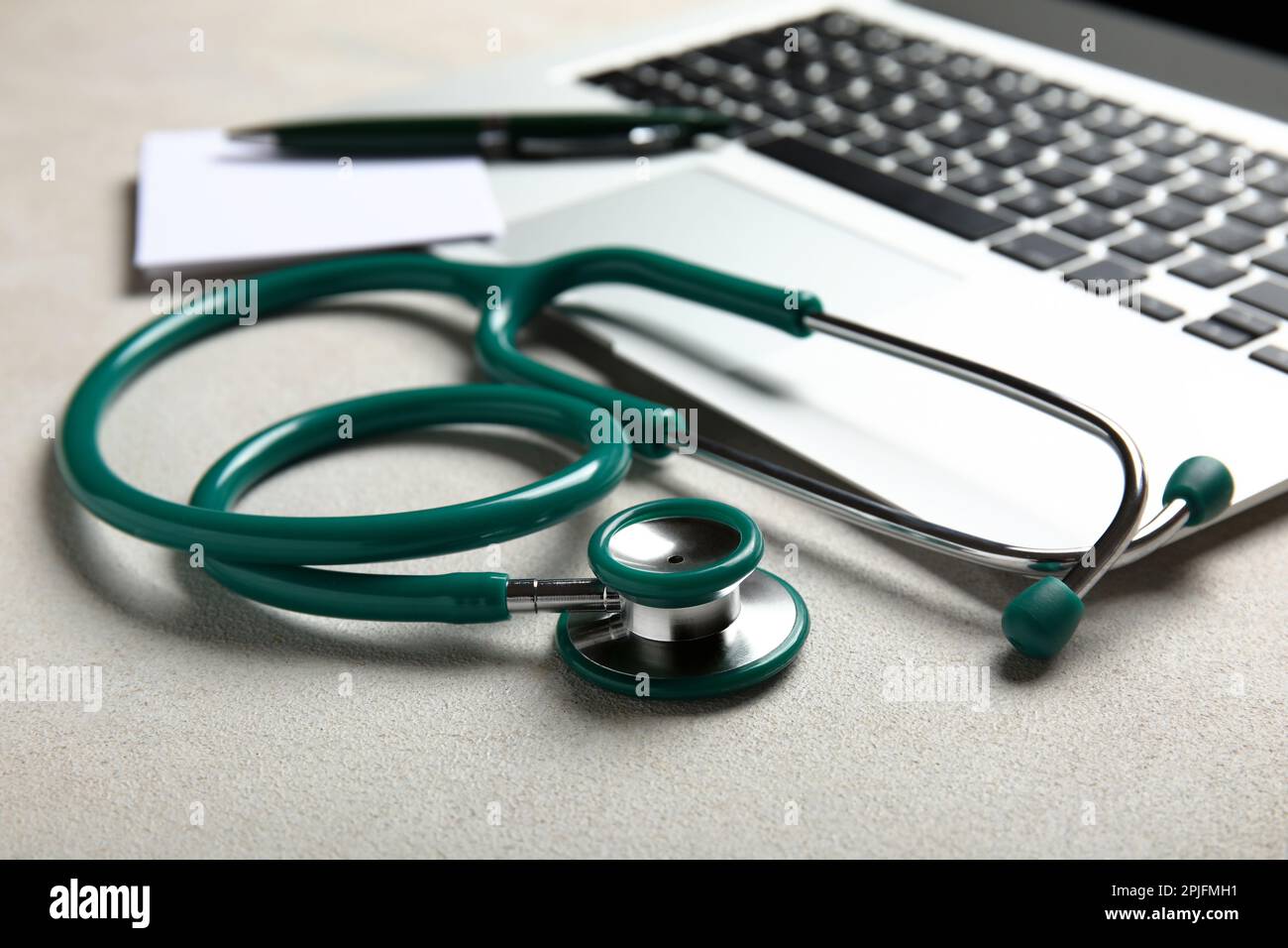 Stethoscope and laptop on light background Stock Photo - Alamy