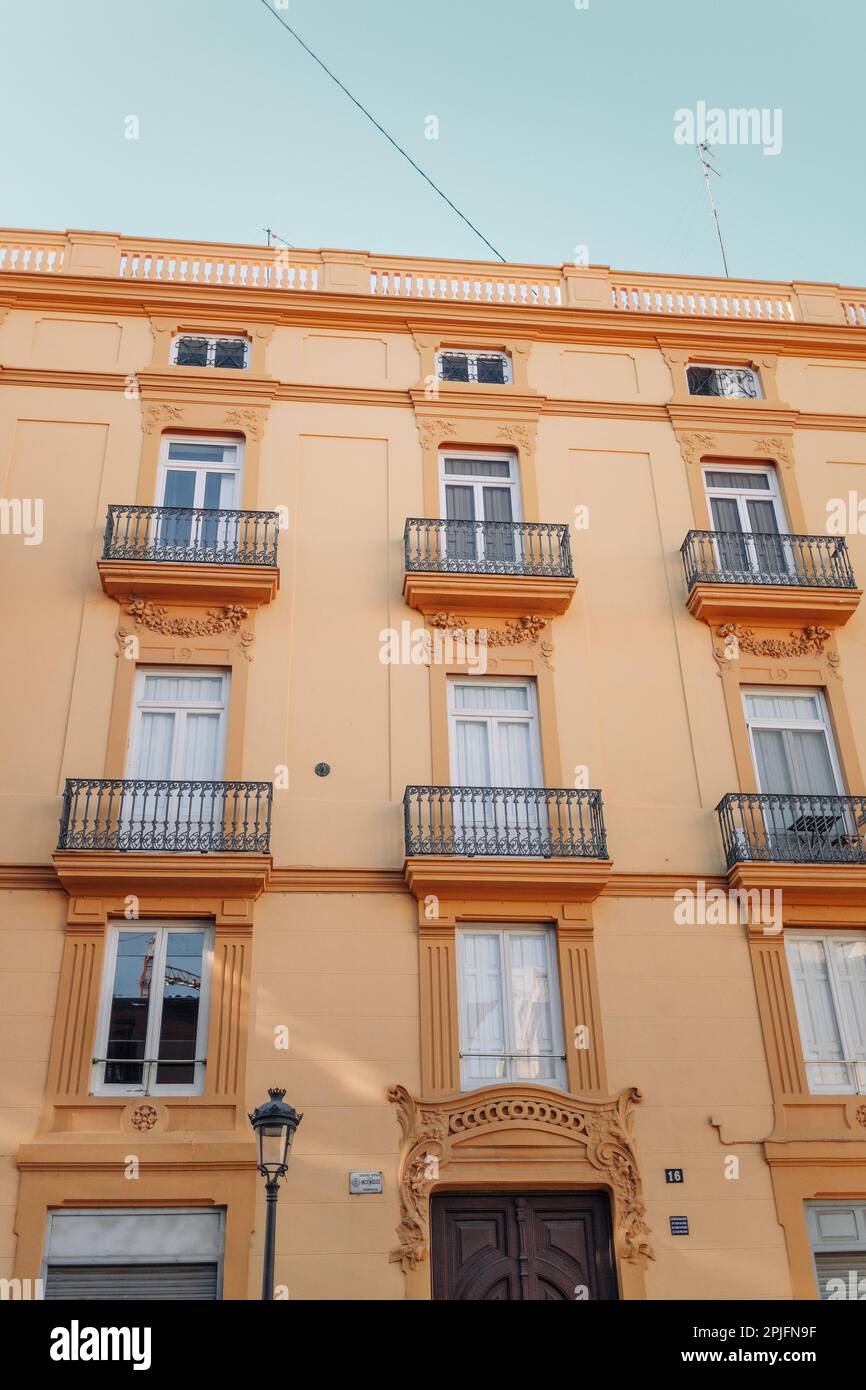 Windows with shutters and small balconies outside on the building ...