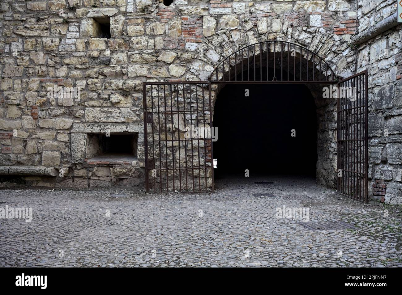 Entrance to a covered passage of a castle in a park on a cloudy day ...
