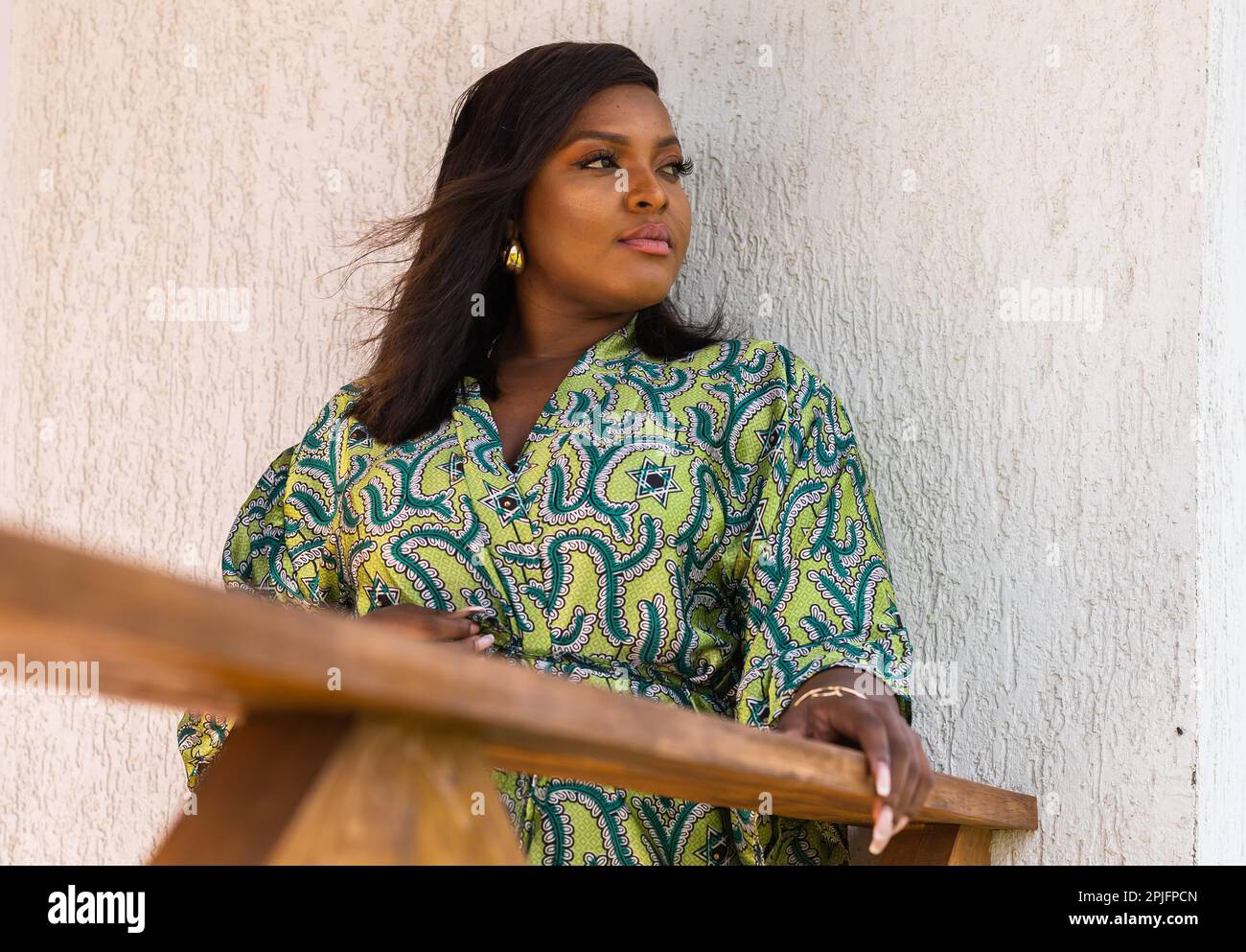 African american woman relaxing and enjoying sun while standing at ...