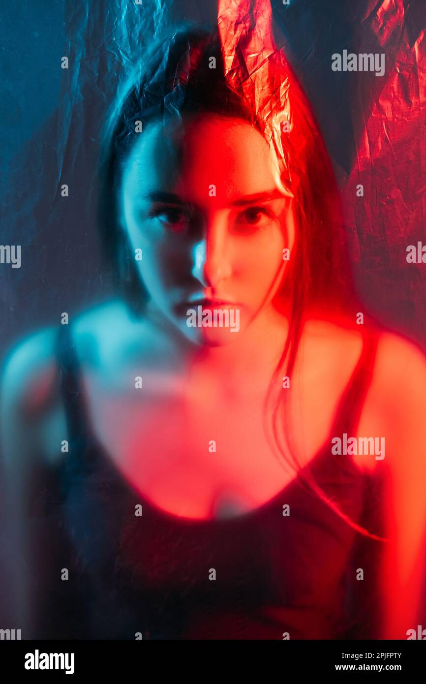 Bipolar disorder red blue color light woman face Stock Photo - Alamy