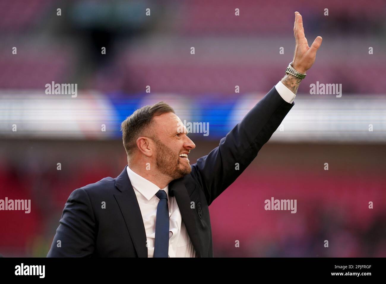 Bolton Wanderers Manager, Ian Evatt, waves at fans following their ...