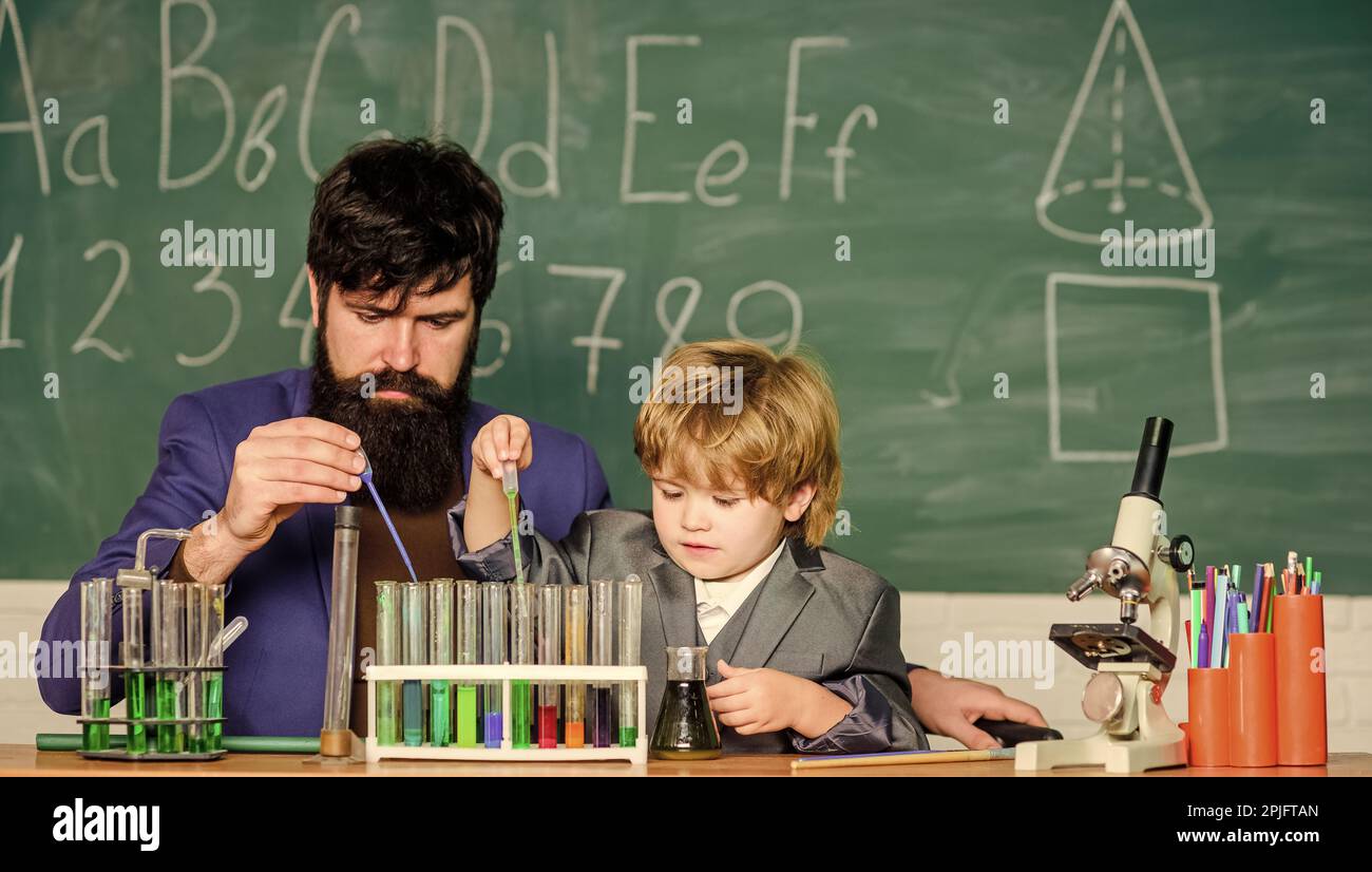 father and son at school. teacher man with little boy. Back to school ...