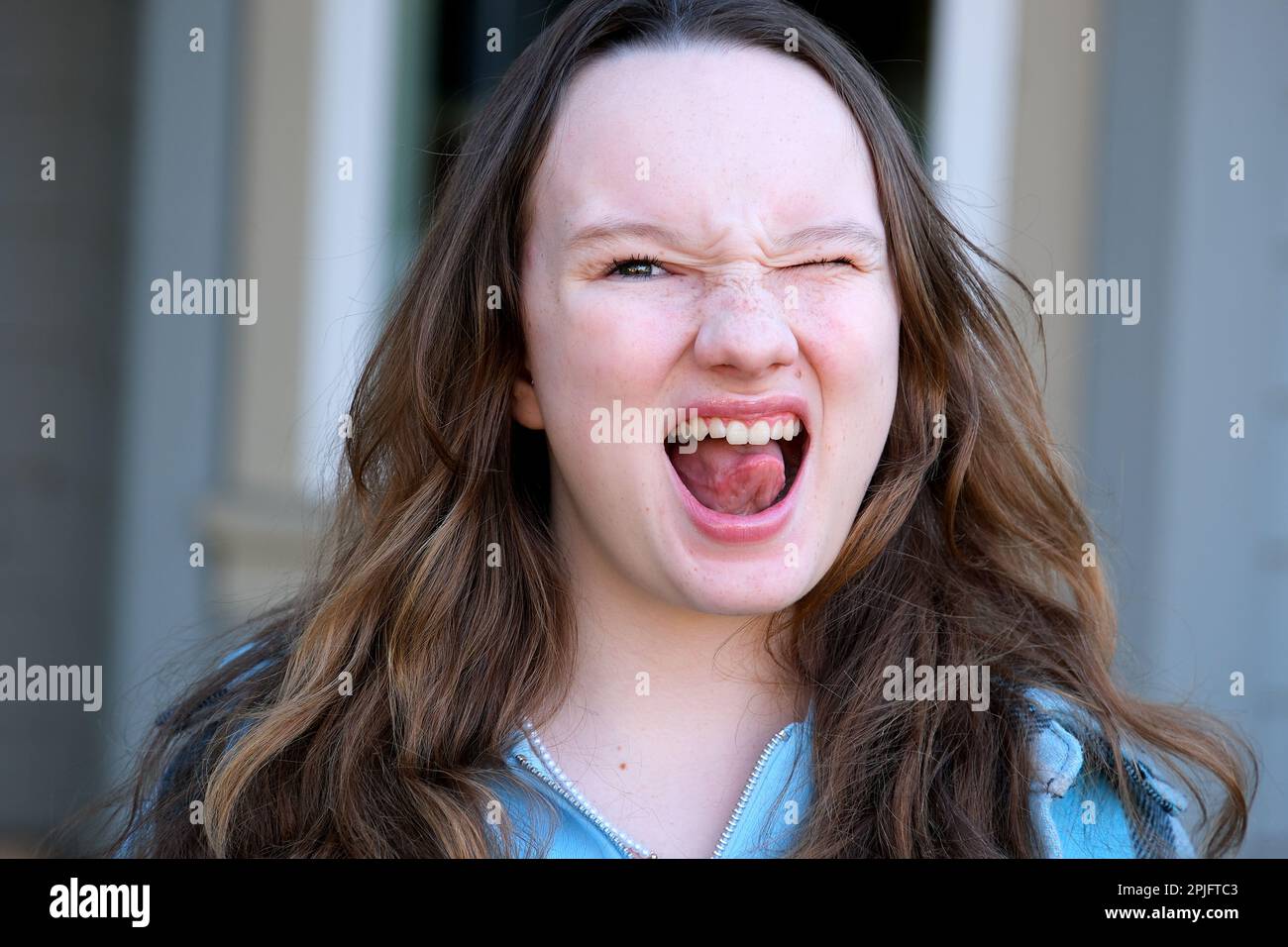 Hello with make faces stick out tongue close one eye teenage girl ...