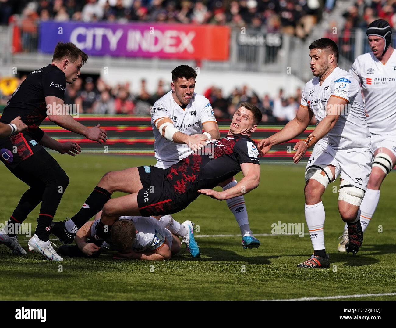Saracens Owen Farrell is tackled by Osprey's Owen Watkins during the ...