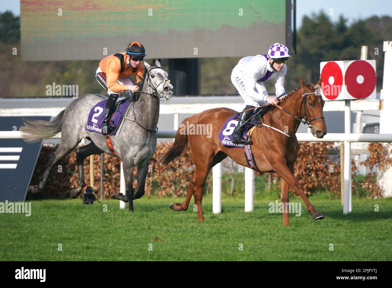 Purple Gown ridden by jockey Luke McAteer (right) wins the Sunday 7th ...