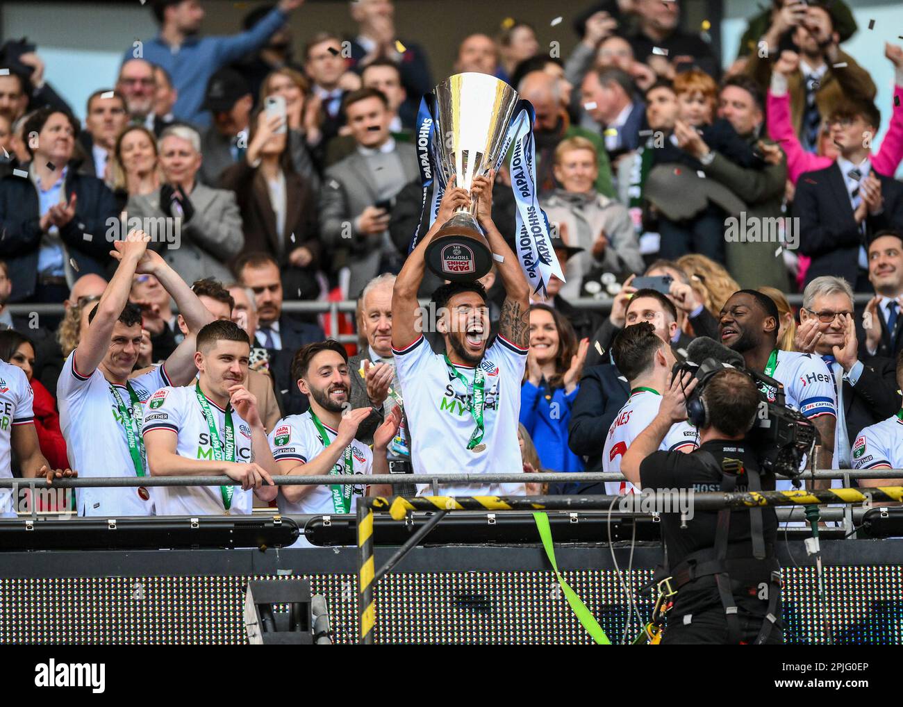 Bolton Wanderers players lift the trophy during the Papa John's Trophy ...