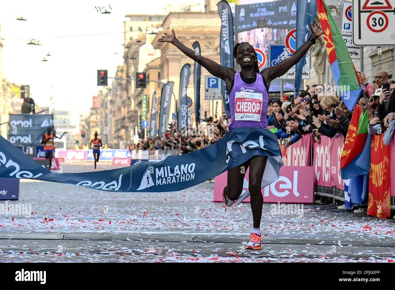 Kenya's Sharon Jemutai Cherop crosses the finish line to win the Milan ...