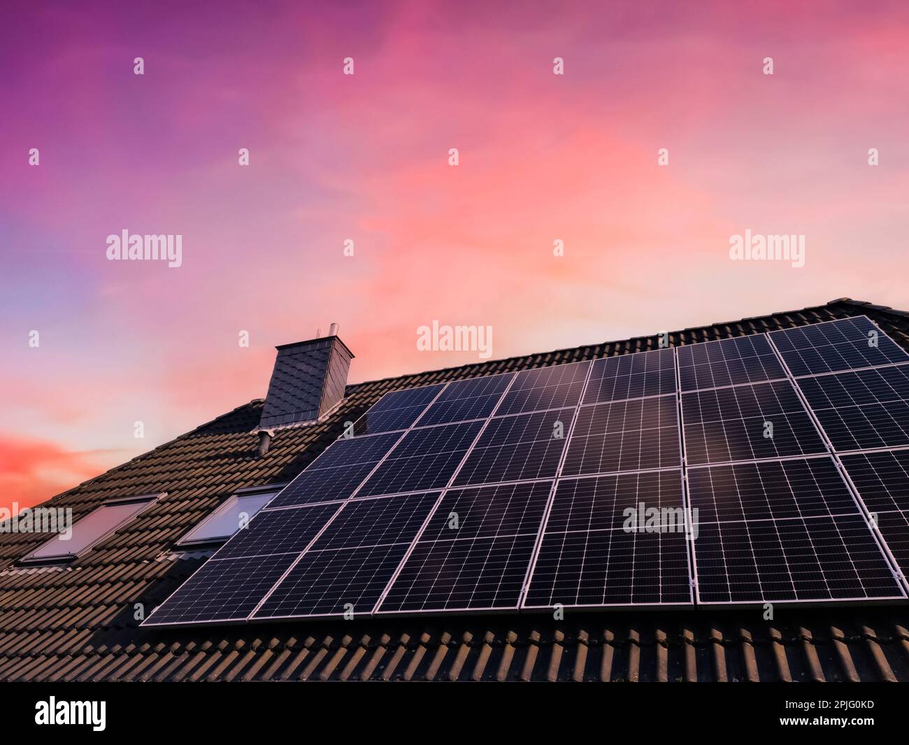 Solar panels producing clean energy on a roof of a residential house ...