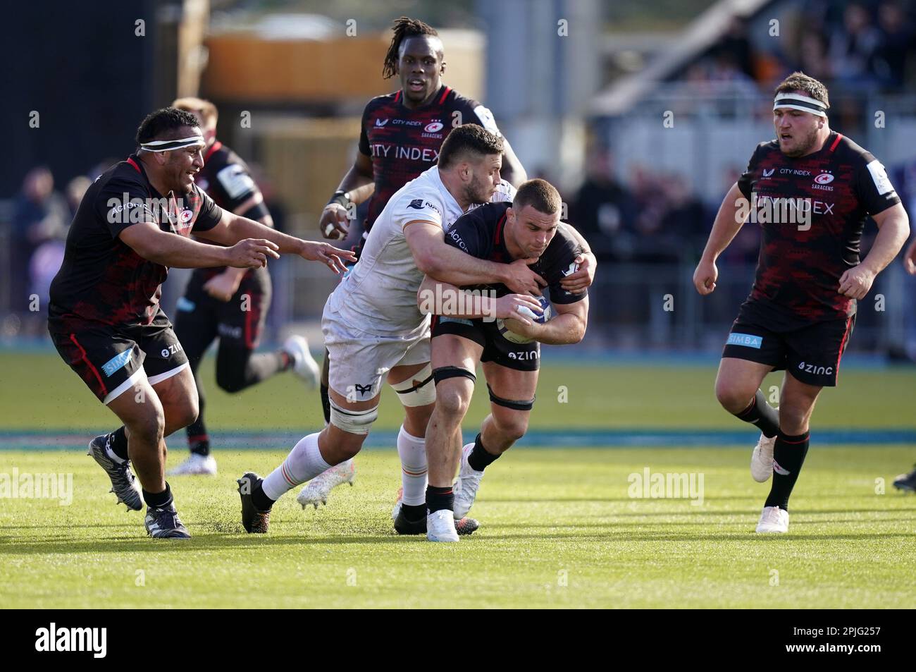 Saracens Ben Earl is tackled by Ospreys Ethan Roots during the Heineken ...