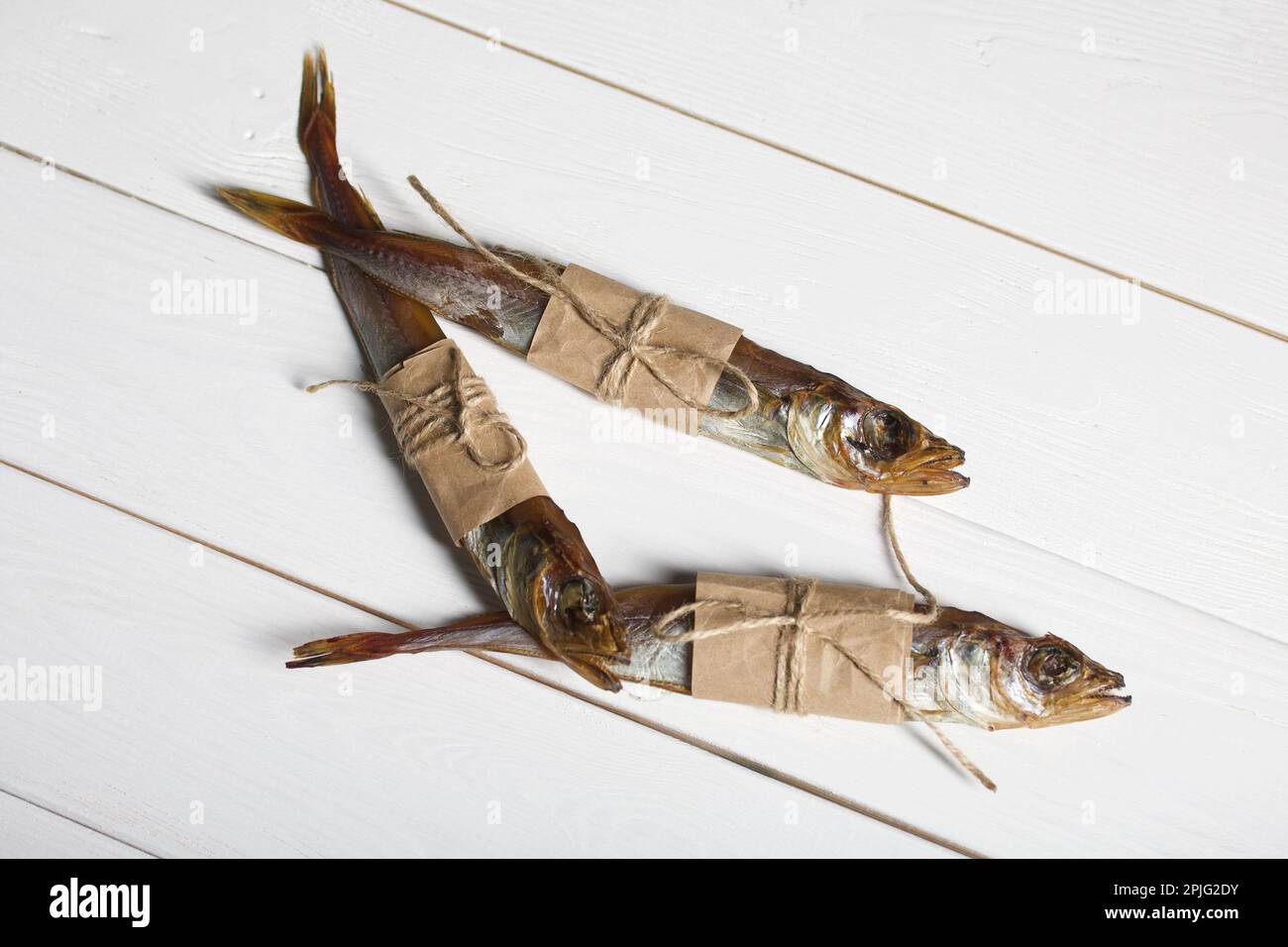 Putassu Cold smoked. The fish is wrapped with a strip of paper. Tied ...