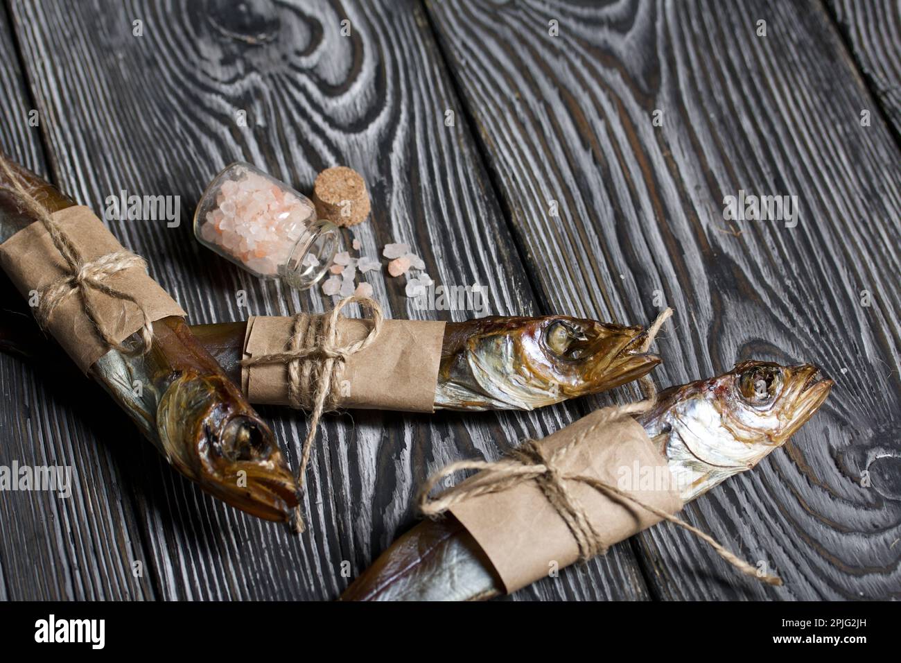 Putassu Cold smoked. The fish is wrapped with a strip of paper. Tied ...