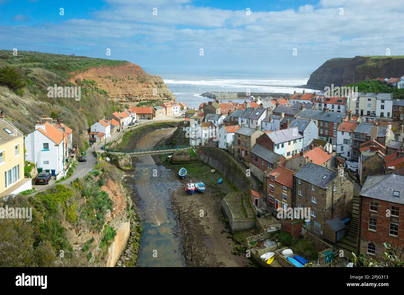 View looking seawards over the harbour of the North Yorkshire Village ...