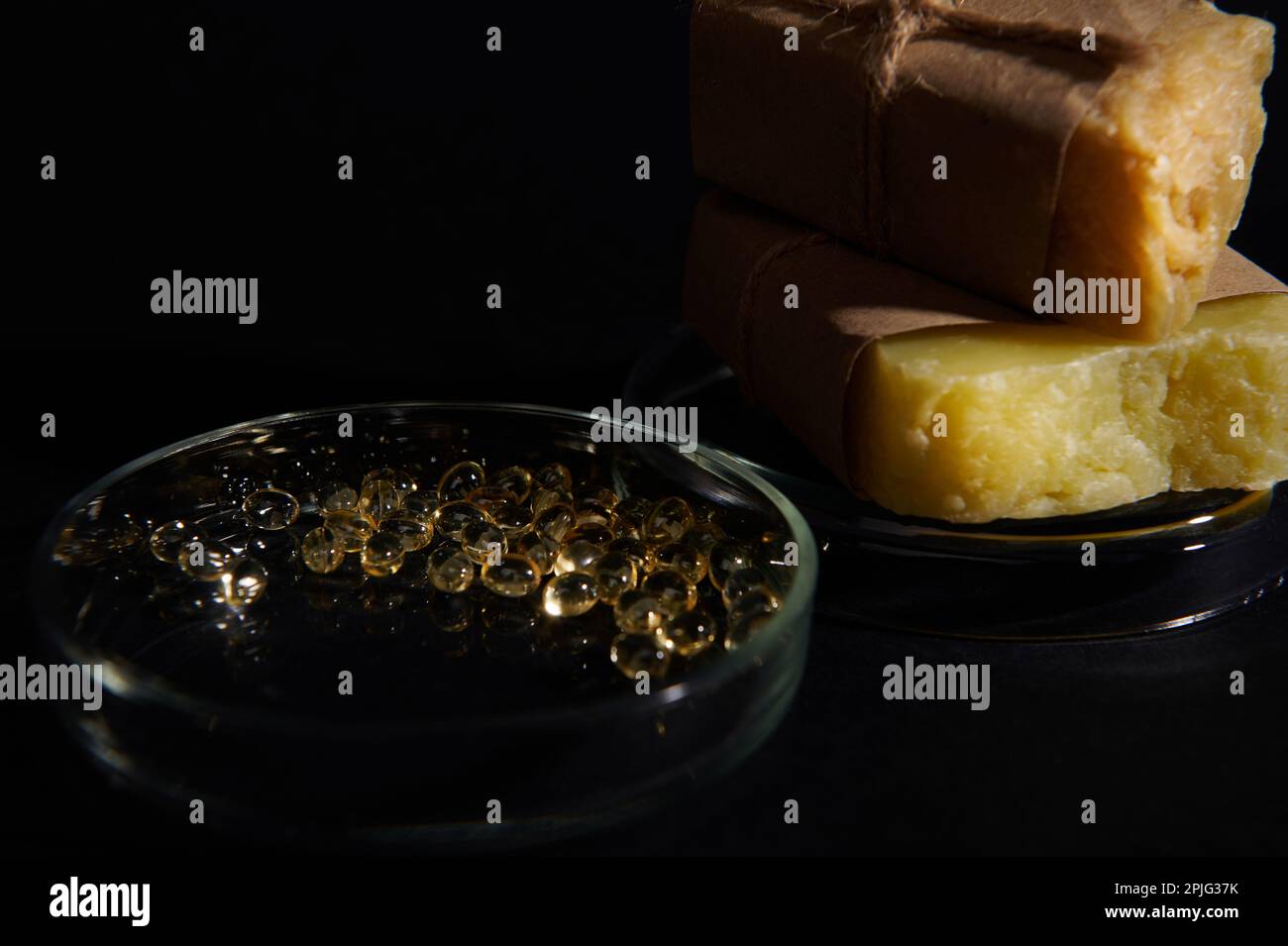 Translucent gel capsules with essential acids and oils in laboratory ...