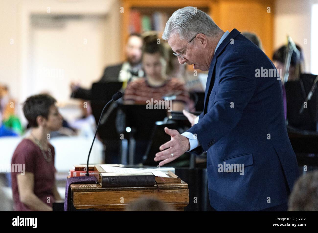 Pastor George Grant leads in a prayer during a Palm Sunday service at ...
