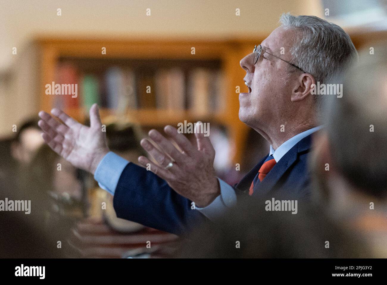 Pastor George Grant leads a prayer during a Palm Sunday service at ...
