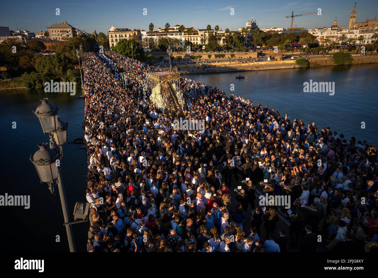 A portable dais platform which supports a statue of the Virgin Mary, is ...