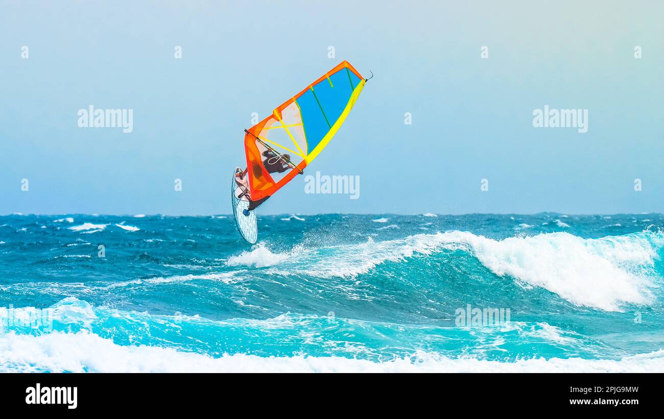 watersports: windsurf rides a wave in the Atlantic Ocean Stock Photo ...