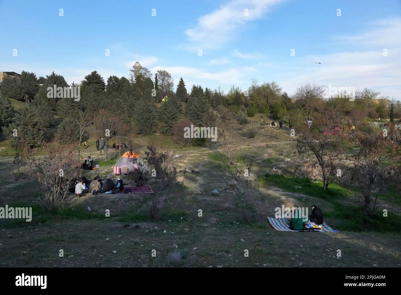 People gather at a park in Tehran, Iran, Sunday, April 2, 2023 ...