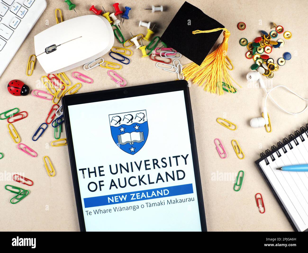In this photo illustration, The University of Auckland logo seen ...