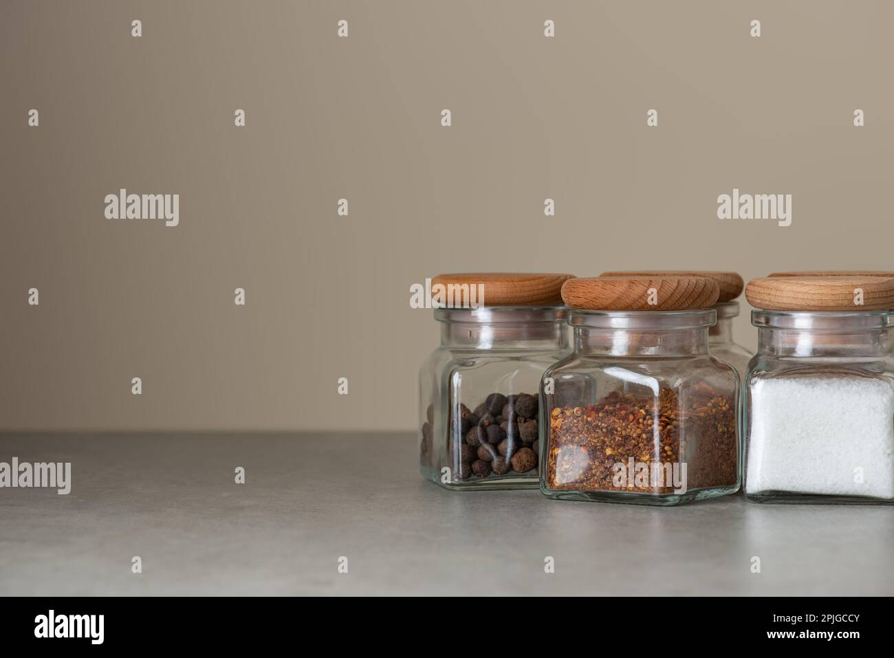 Culinary background with spices on a gray kitchen table, side view ...