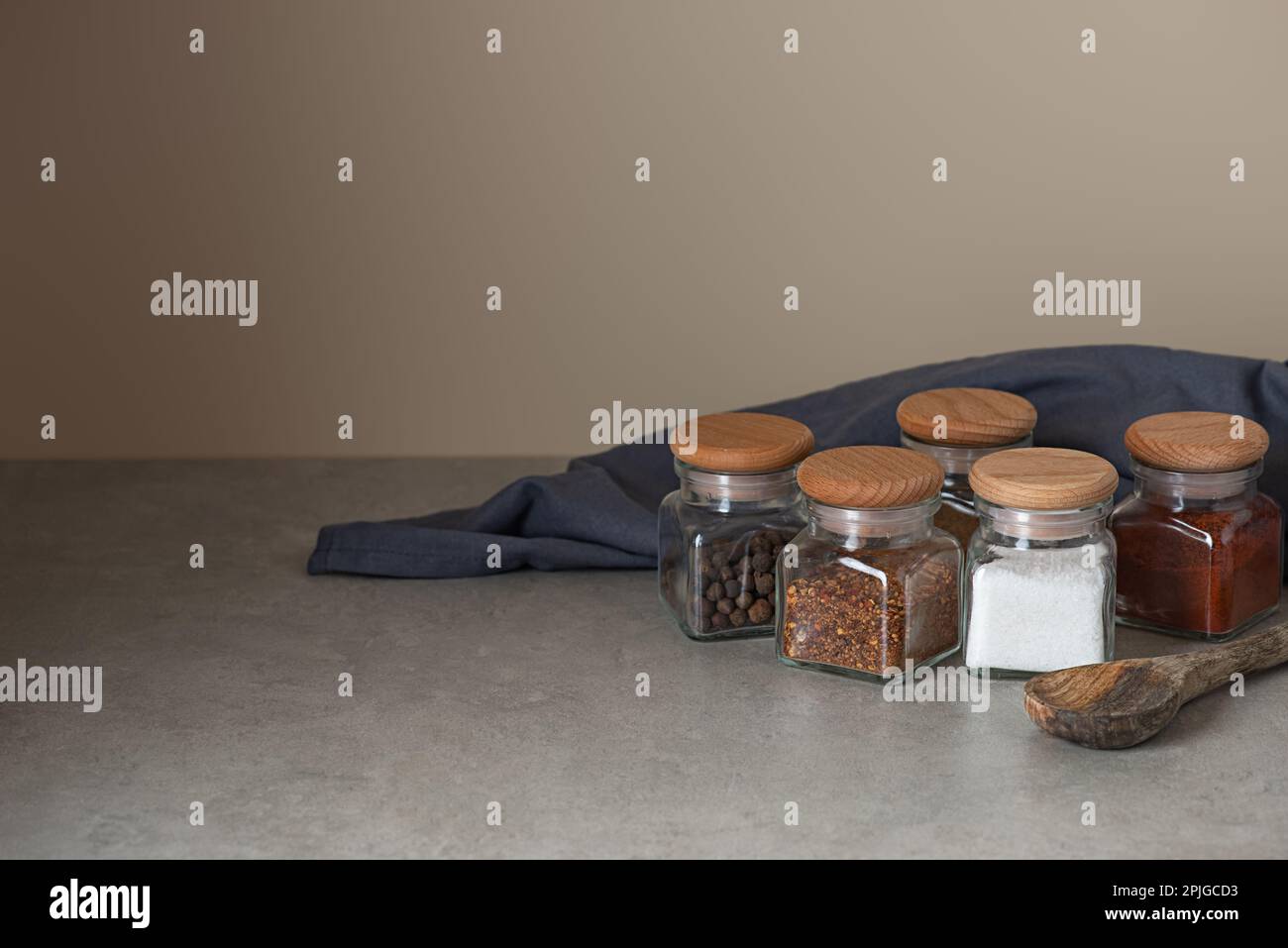 Culinary background with spices on a gray kitchen table, side view ...