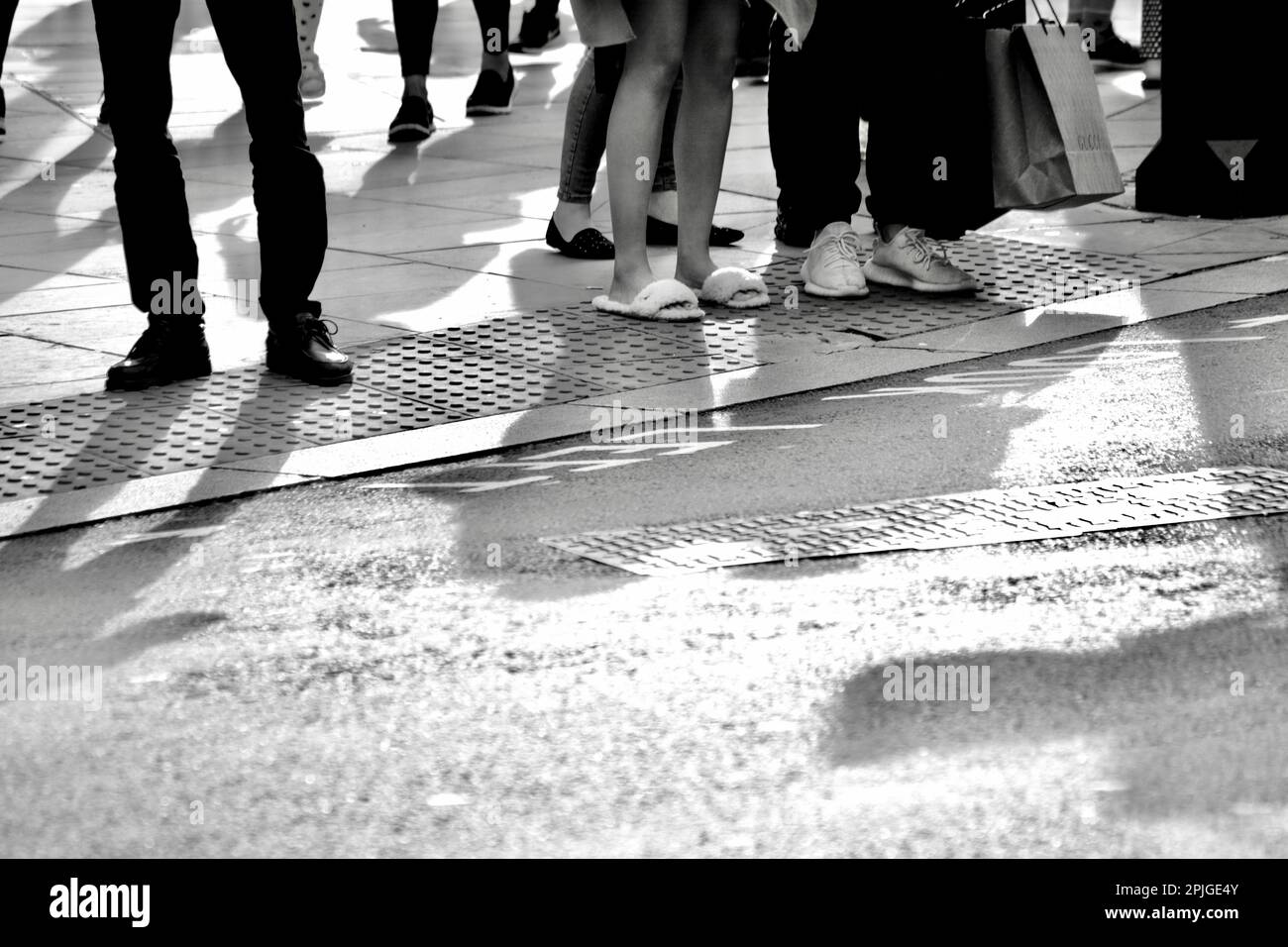 Feet moving very fast on the streets of central London. Motion blur for ...