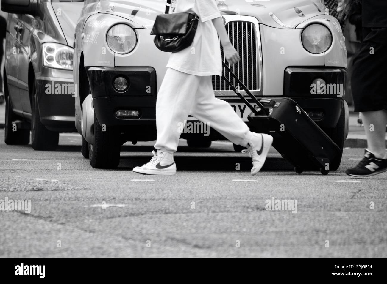 Feet moving very fast on the streets of central London. Motion blur for ...