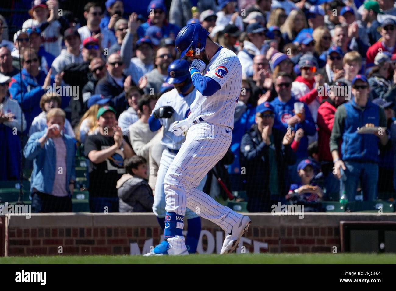 Chicago Cubs third baseman Patrick Wisdom reacts after hitting a home ...