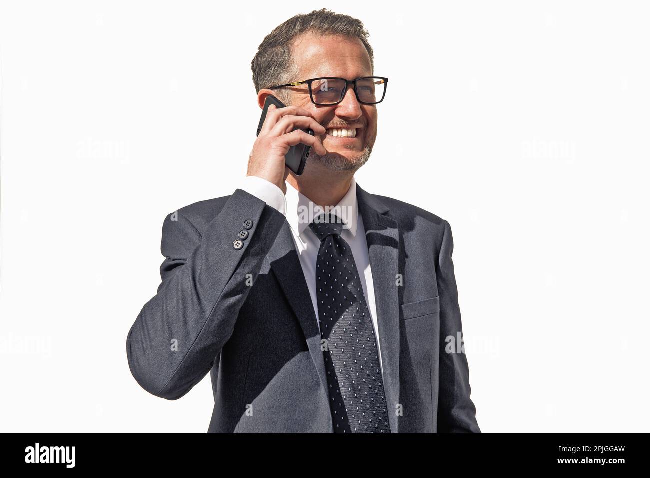 Business man in a suit calling someone, in white background, the ...