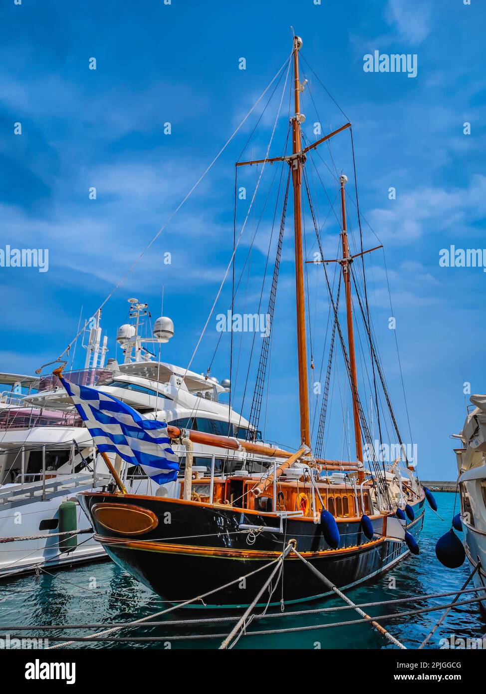 A classic luxury sailing ship in the port of Piraeus among yachts on a ...