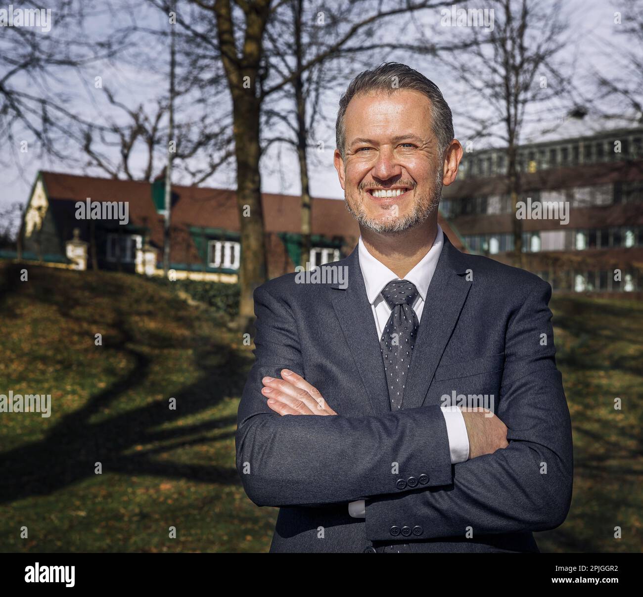 Successful smiling business man, professor, in University Park ...