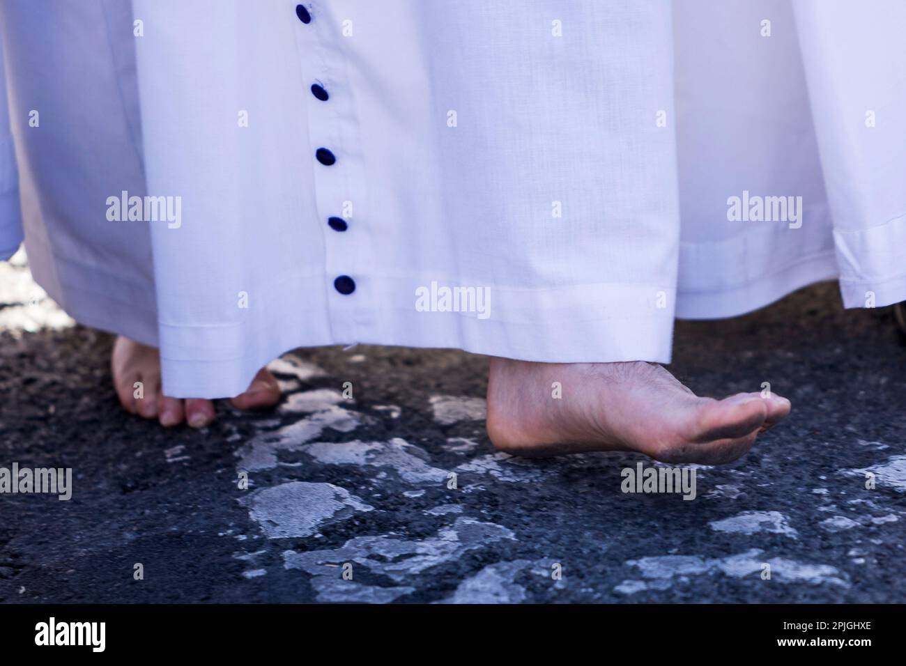 Seville, Spain. 2nd Apr, 2023. A a barefoot penitent (nazareno) of the ...