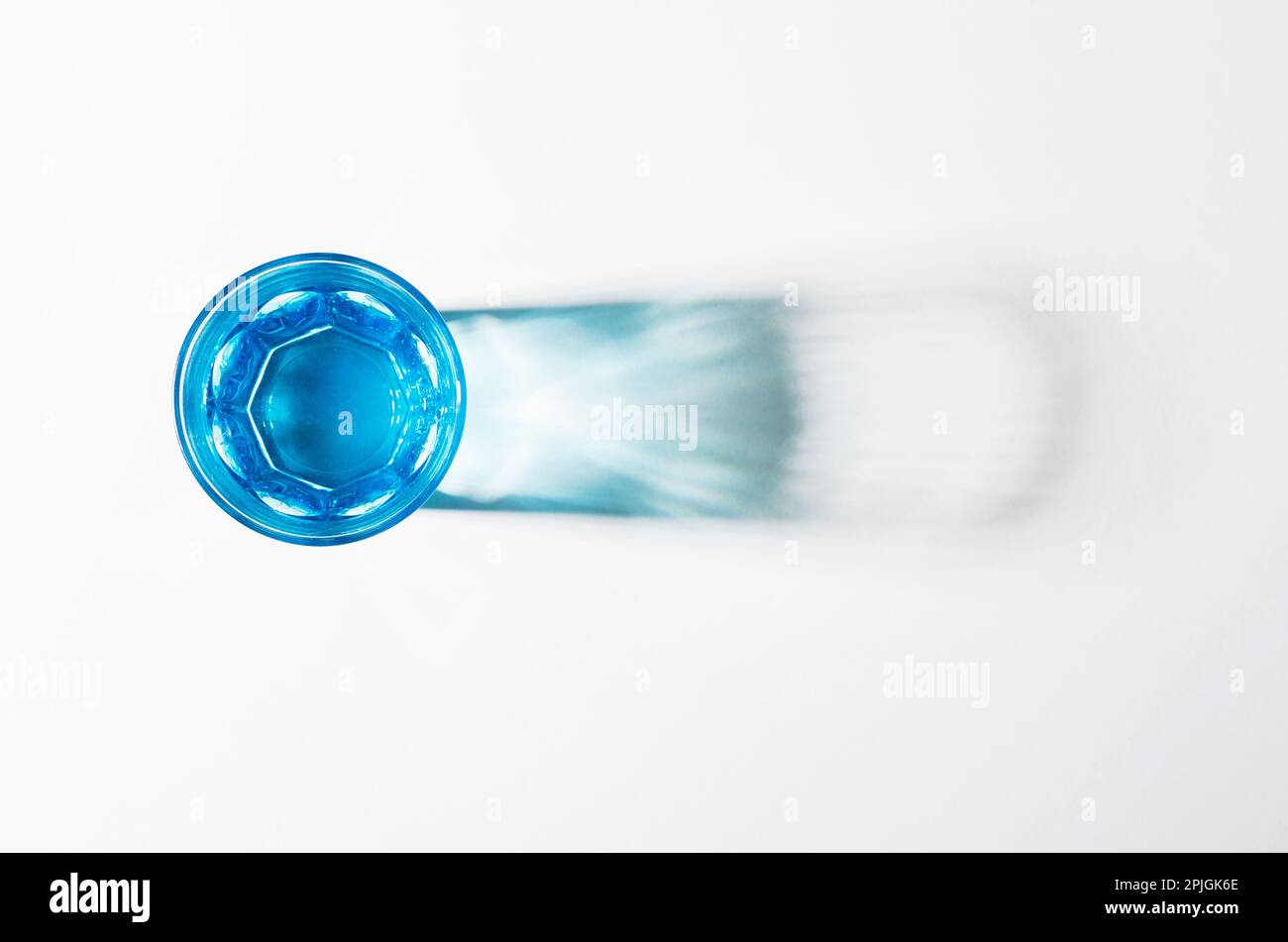 A Glass with Water and Sharp Shadows, Caustic Effect as Light Passes ...