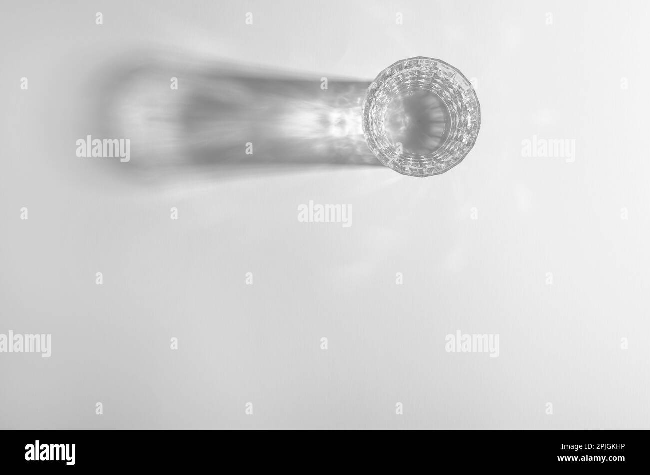 A Glass with Water and Sharp Shadows, Caustic Effect as Light Passes ...