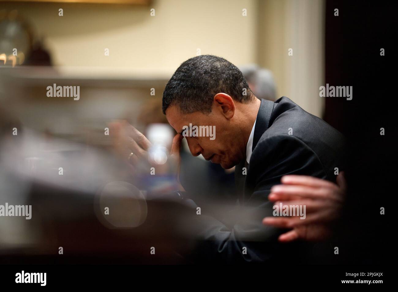 President Barack Obama reflects during a budget meeting in the ...