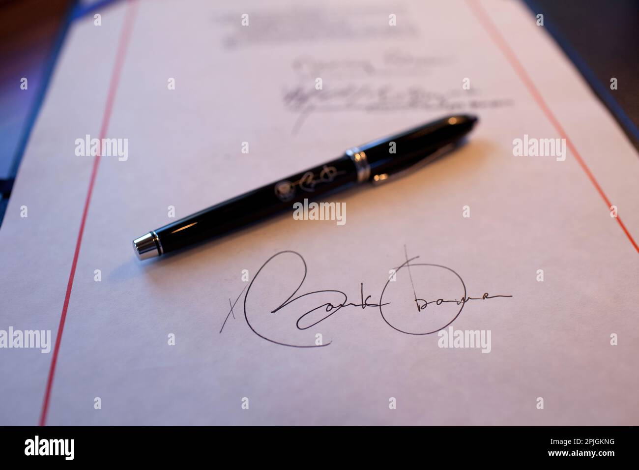 Close-up detail of President Obama's signature on a bill, and a pen ...