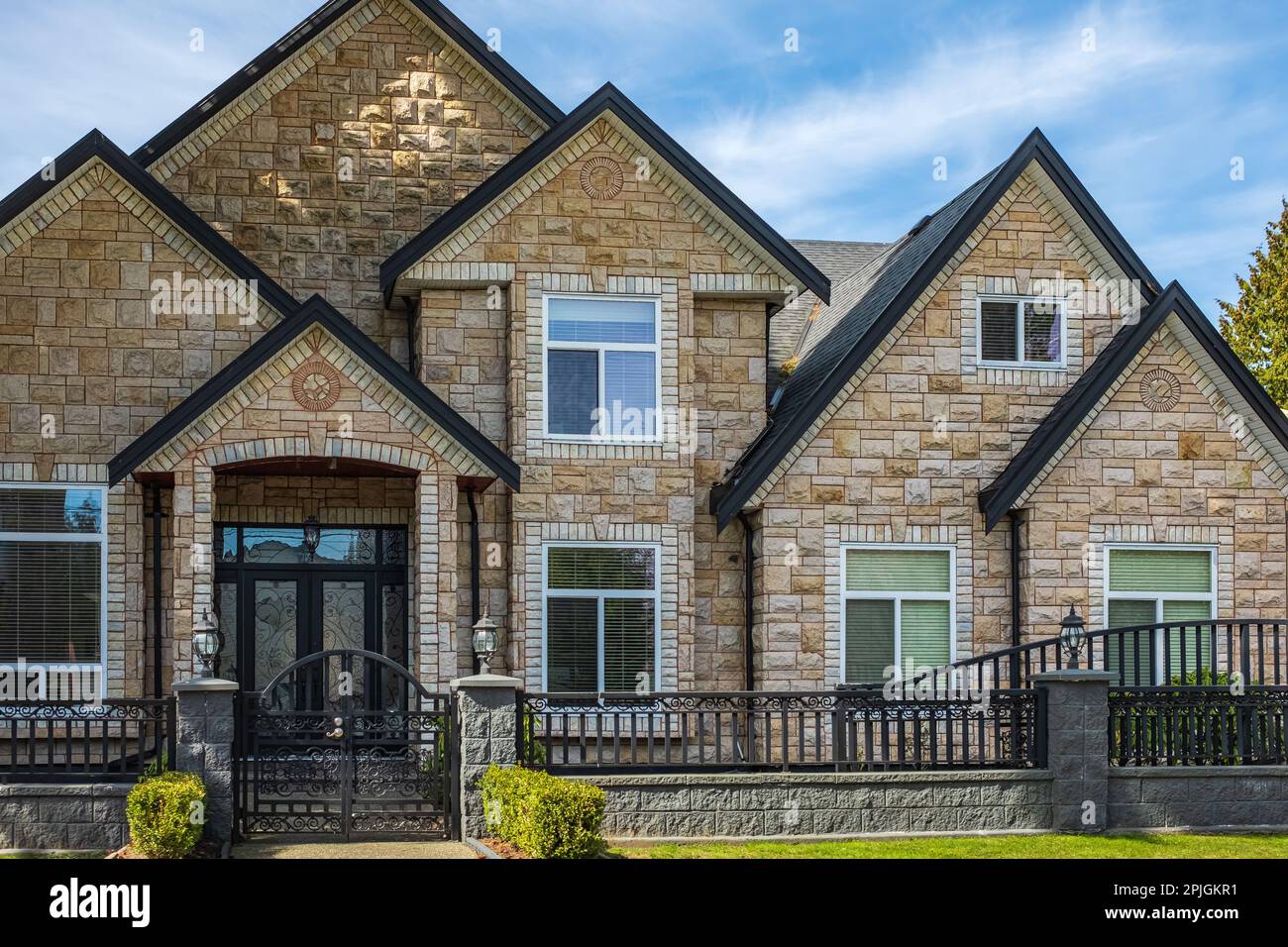 Real Estate Exterior Front House on a sunny day. Big custom made luxury ...