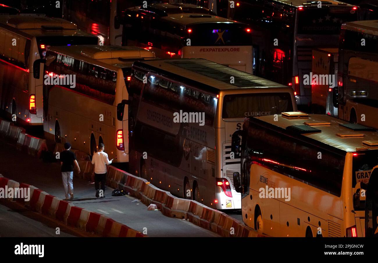 Coaches wait in to the evening to enter the Port of Dover in Kent after ...
